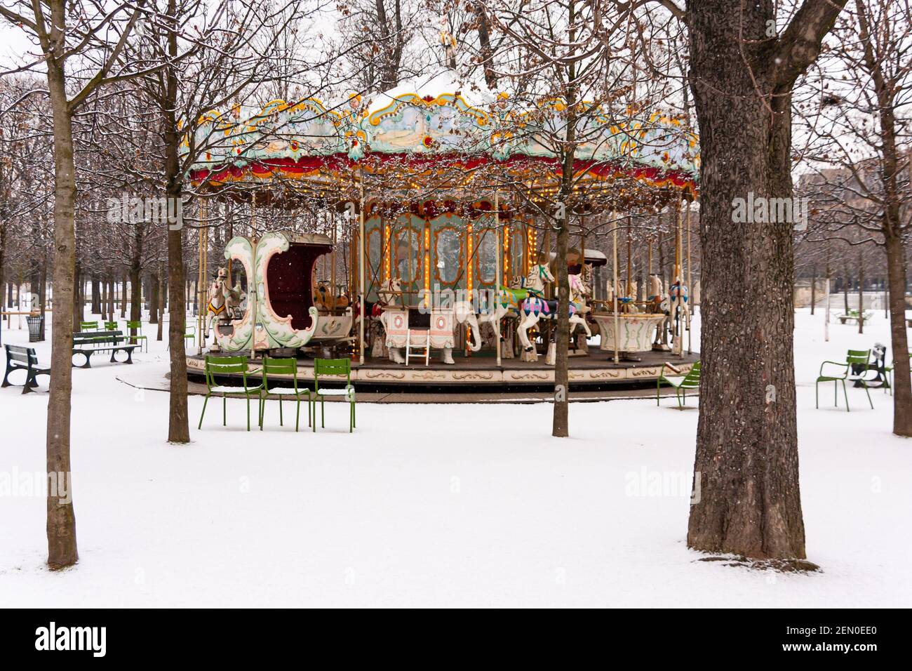 Carousel surrounded by snow in the Jardin de Tuileries in Paris France ...
