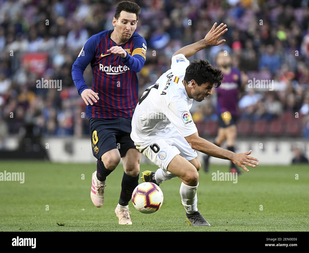 Lionel Messi of FC Barcelona and Leandro Cabrera of Getafe CF during ...