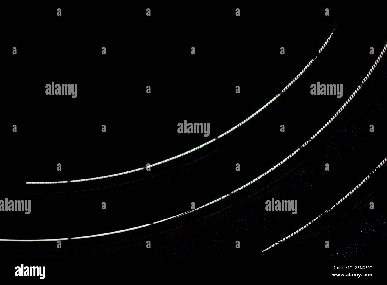 White dotted arches on a black background Stock Photo - Alamy