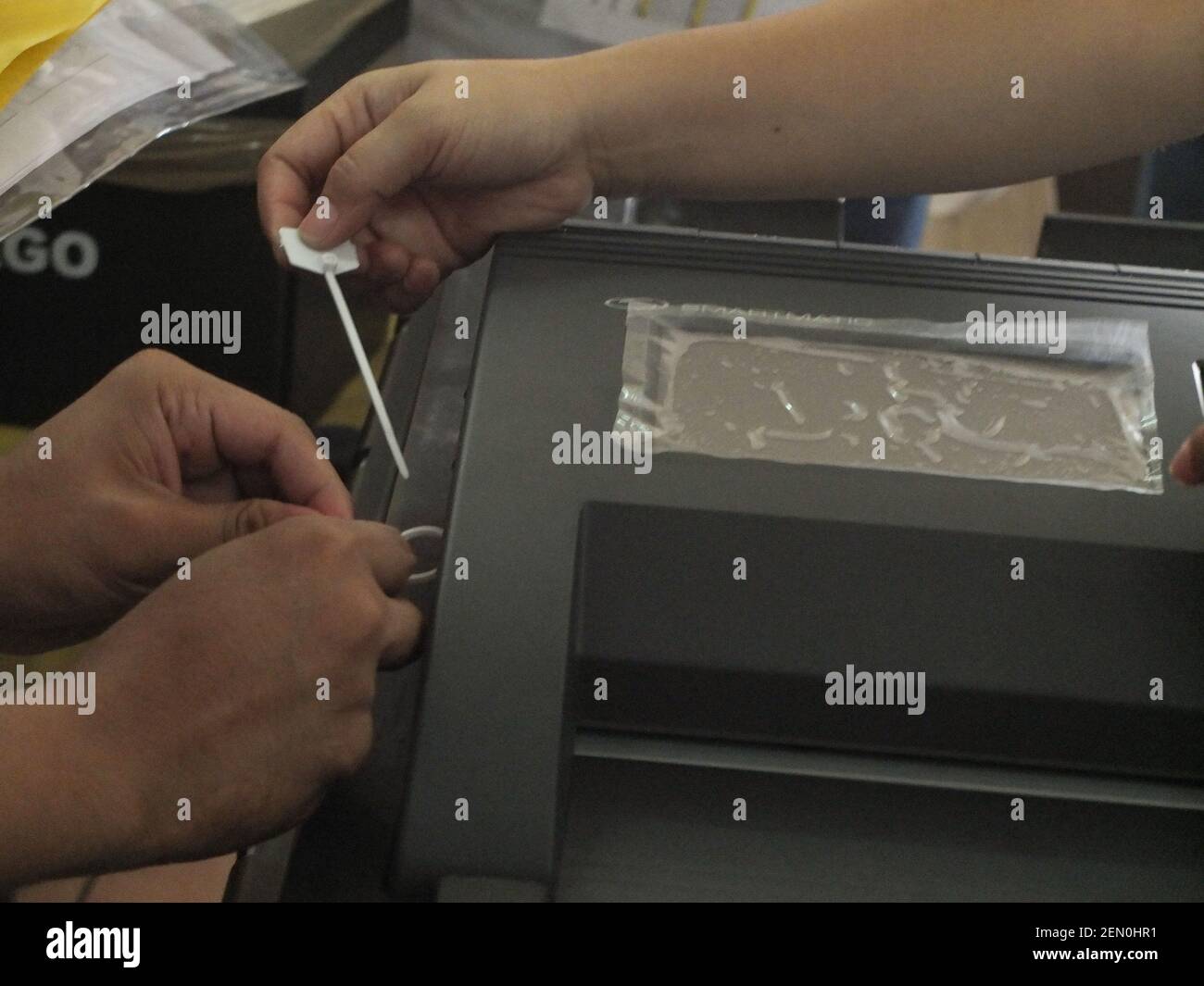 A Election board inspector seen operating the PCOS machine during the ...