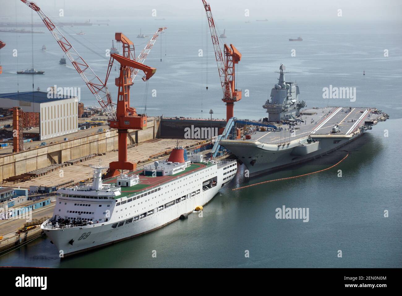 China's first domestically built aircraft carrier, the Type 001A, docks ...