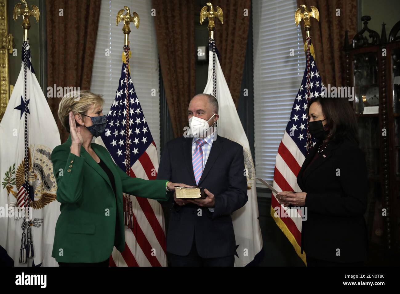 U.S. Secretary of Energy Jennifer Granholm (L) is sworn in with her ...