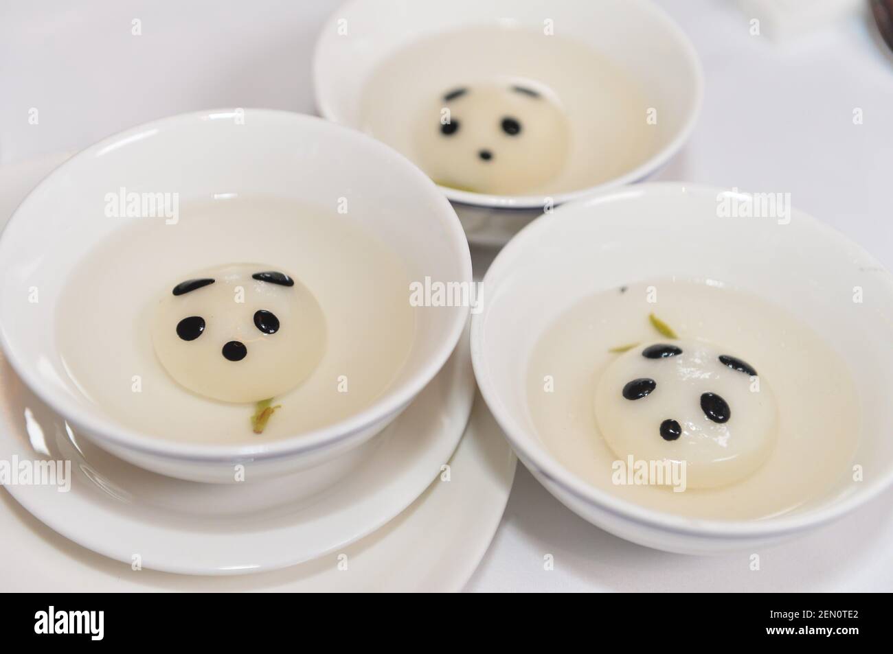 Desserts featuring shape of giant panda are served for visitors during ...