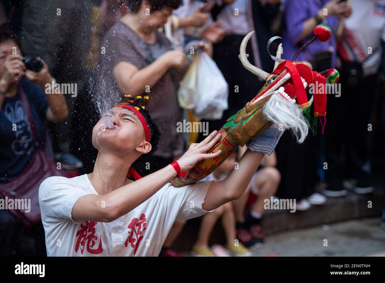 People perform drunk dragon dance during the Drunken Dragon Festival to ...