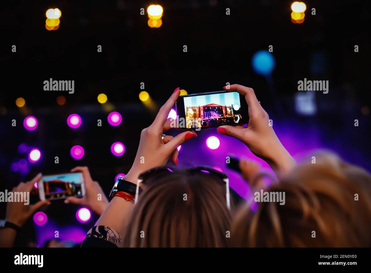 People holding their smart phones and photographing concert Stock Photo ...
