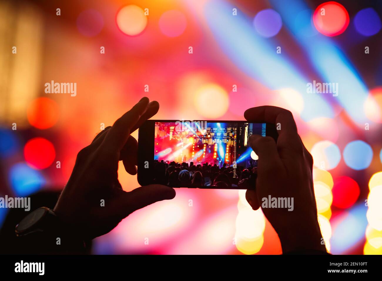 People holding their smart phones and photographing concert Stock Photo ...