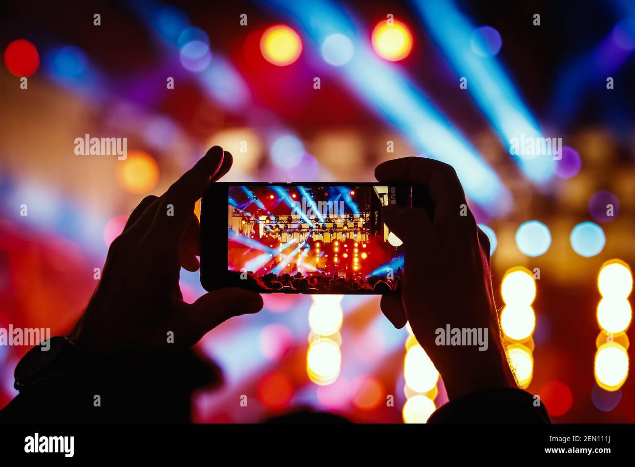 People holding their smart phones and photographing concert Stock Photo ...