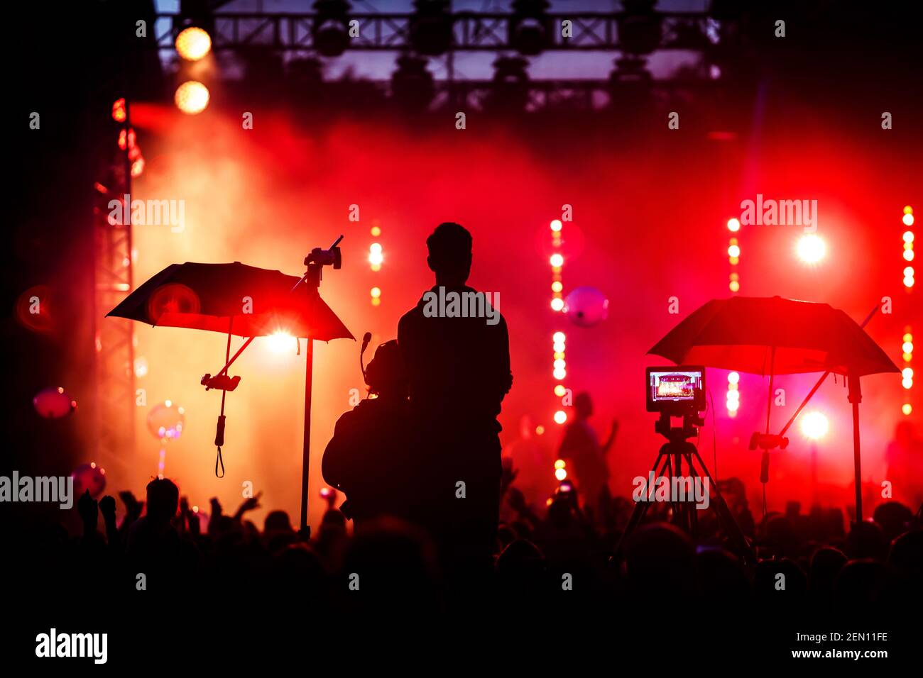 Crew team working to setting and preparing production for show event or ...