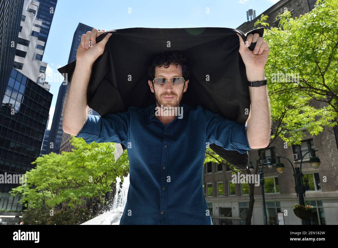 Under his focusing cloth, photographer Brendan Barry poses for a ...