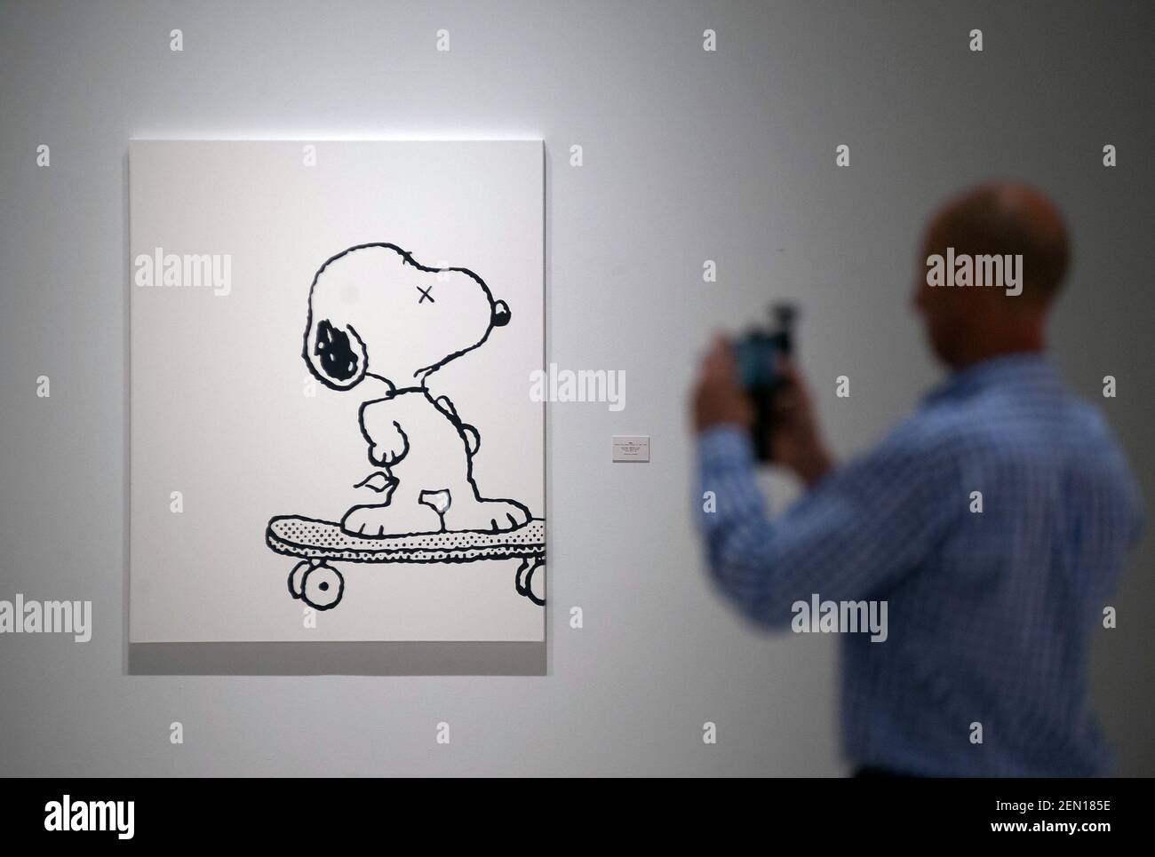 A photographer seen taking pics of a painting of Snoopy during the ...