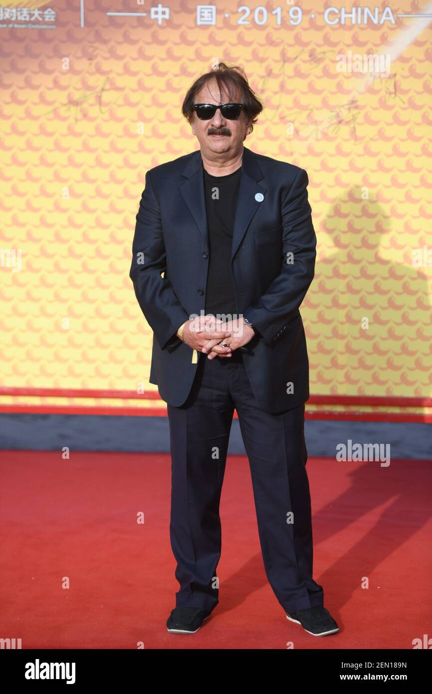 Iranian film director and producer Majid Majidi poses as he arrives on ...