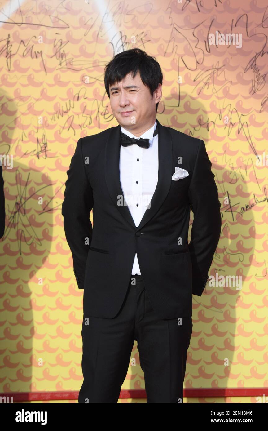 Chinese comedian and actor Shen Teng poses as he arrives on the red ...