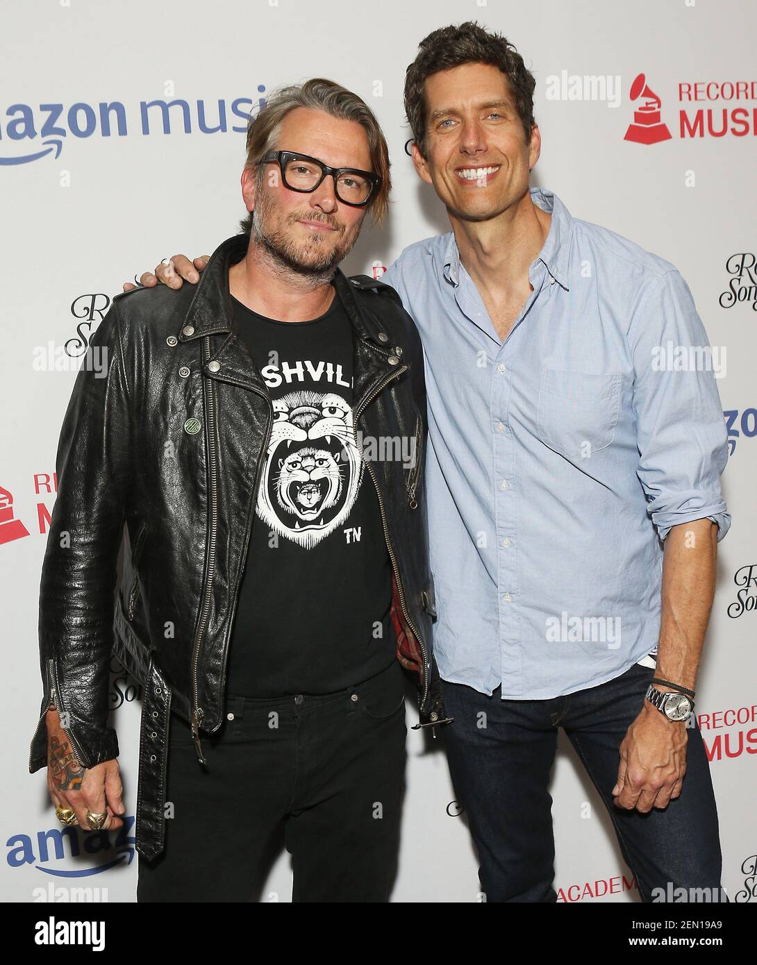 Kevin Griffin (R) and Butch Walker arrive at the MusiCares Concert for ...