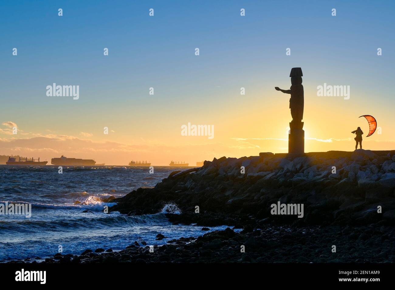 Coast Salish Welcome Figure, Ambleside Park, sunset, West Vancouver, British Columbia, Canada ...