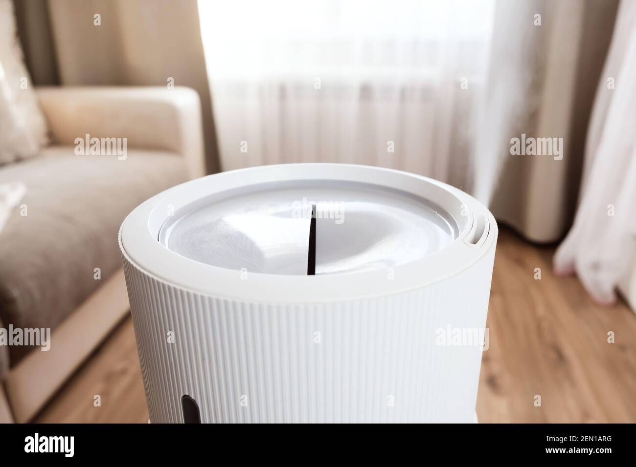 Steam from modern air humidifier, aroma oil diffuser at home. Improving ...