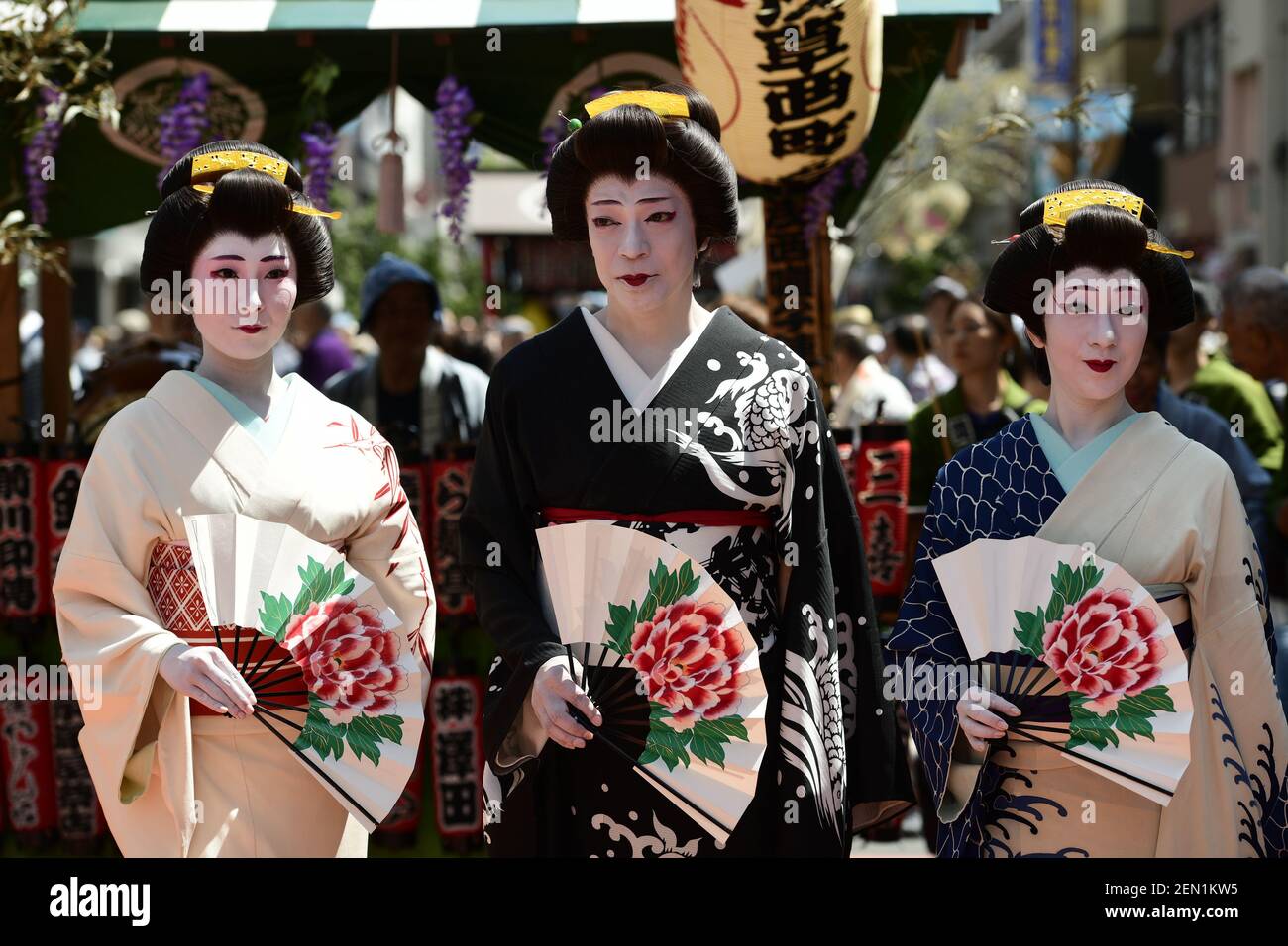 TOKYO, JAPAN - MAY 19: Women in kimono parade in the street of Asakusa ...