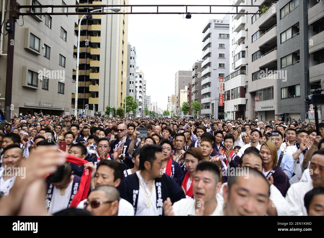 TOKYO, JAPAN - MAY 19: Participants clap at the end of the parade ...