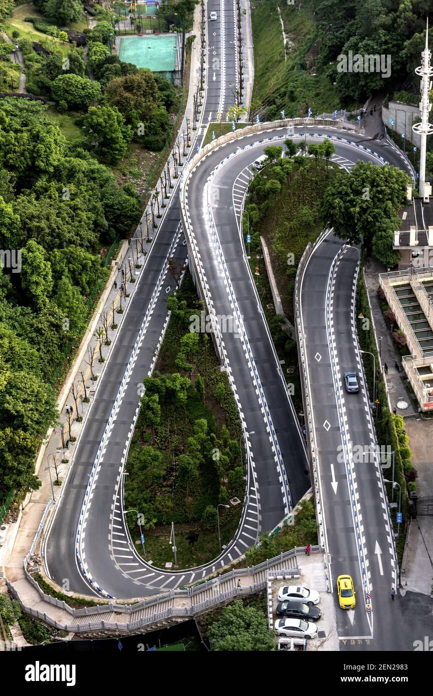 Aerial view of a stunning spiral highway, which is part of the city's ...