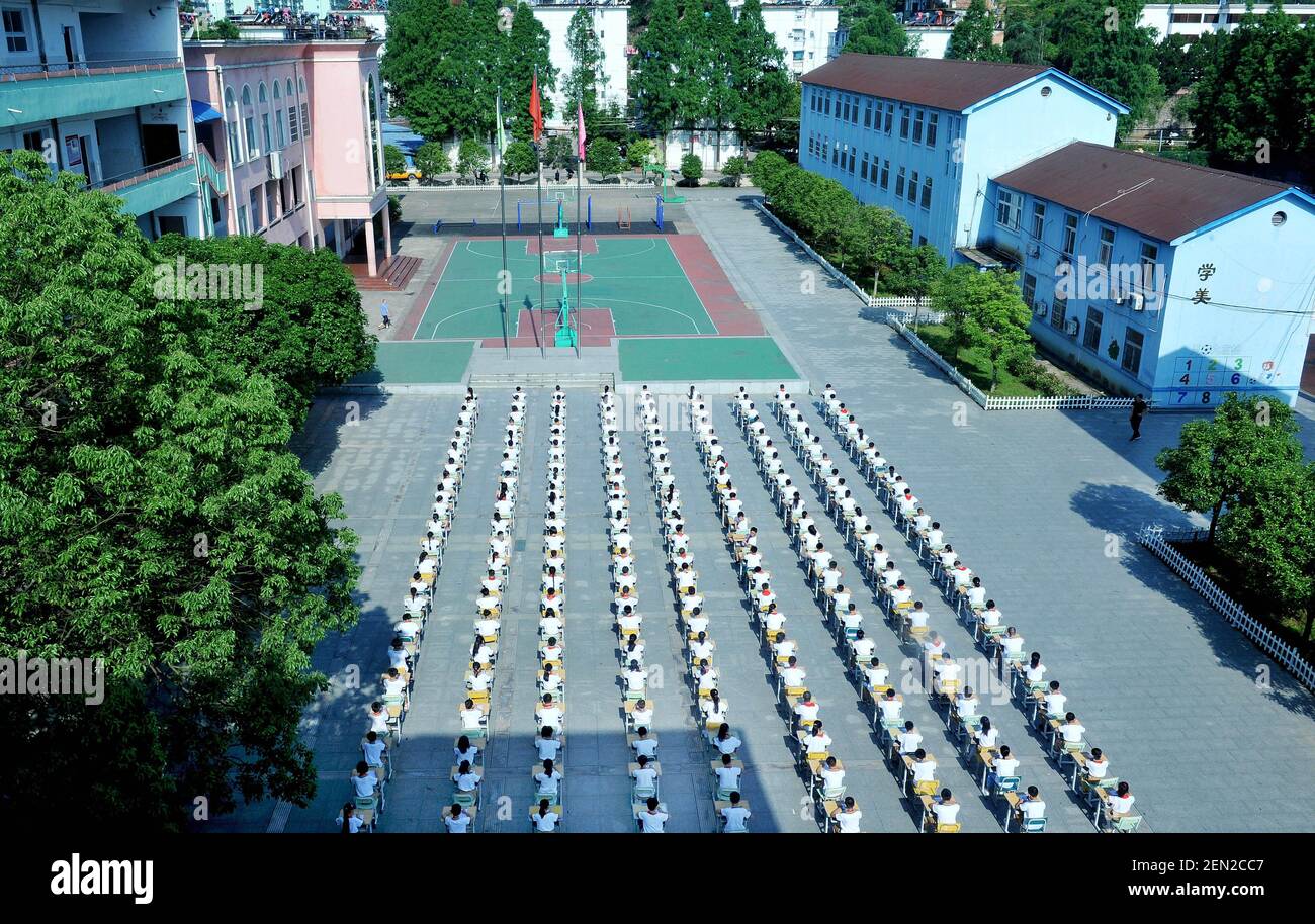 Chinese primary school students sit in rows as they practice ...