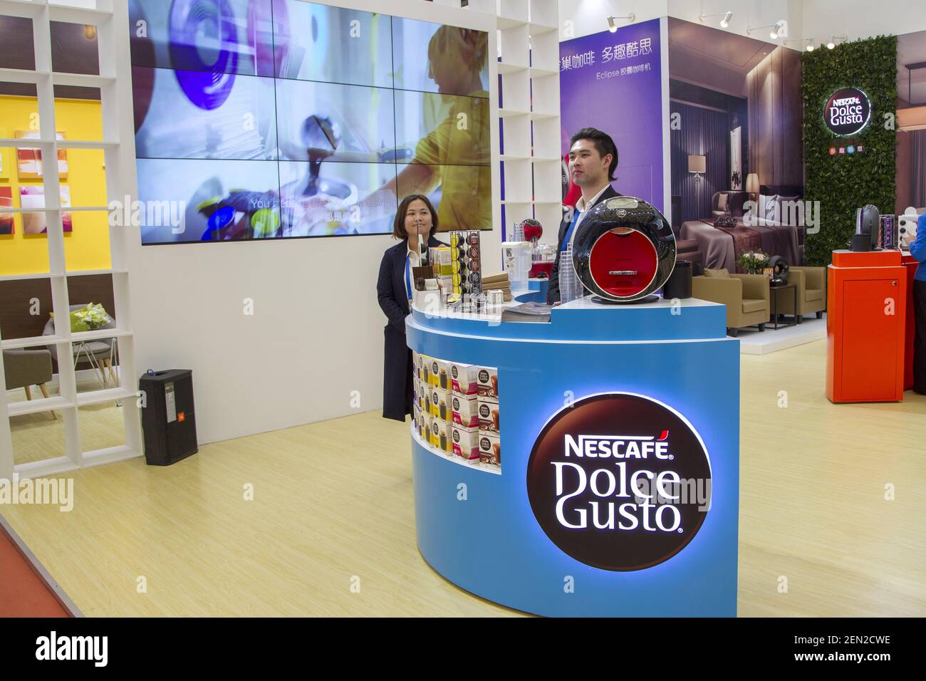 --FILE--People visit the stand of Nescafe instant coffee of Nestle ...