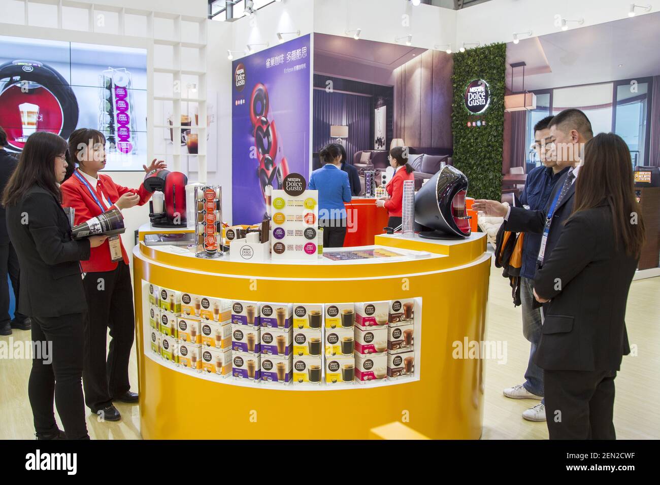 --FILE--People visit the stand of Nescafe instant coffee of Nestle ...