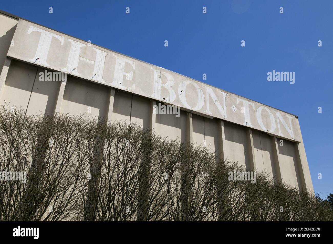 The outline of a The Bon-Ton logo sign outside of a closed retail store ...