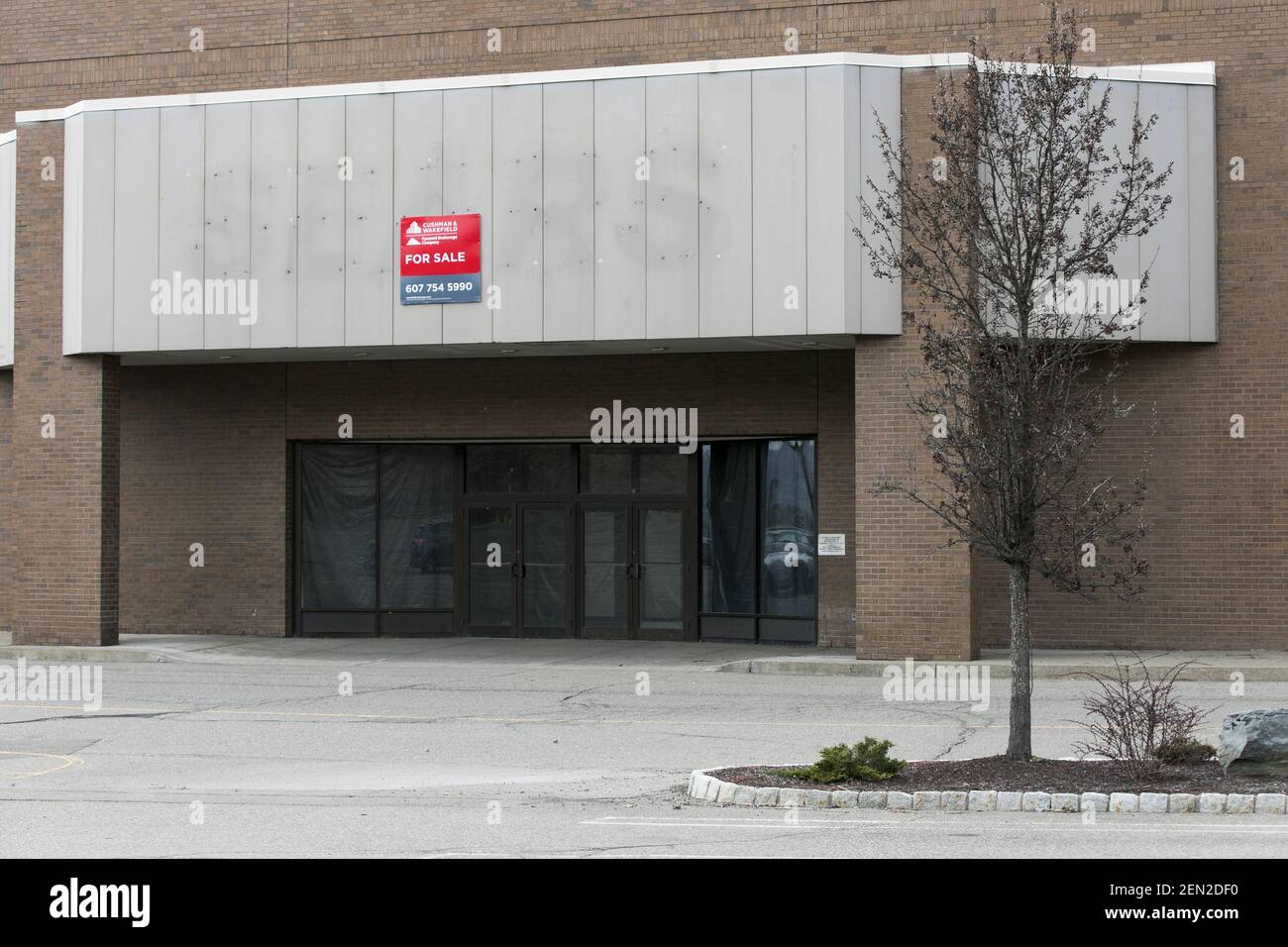 The outline of a Sears logo sign outside of a closed retail store ...