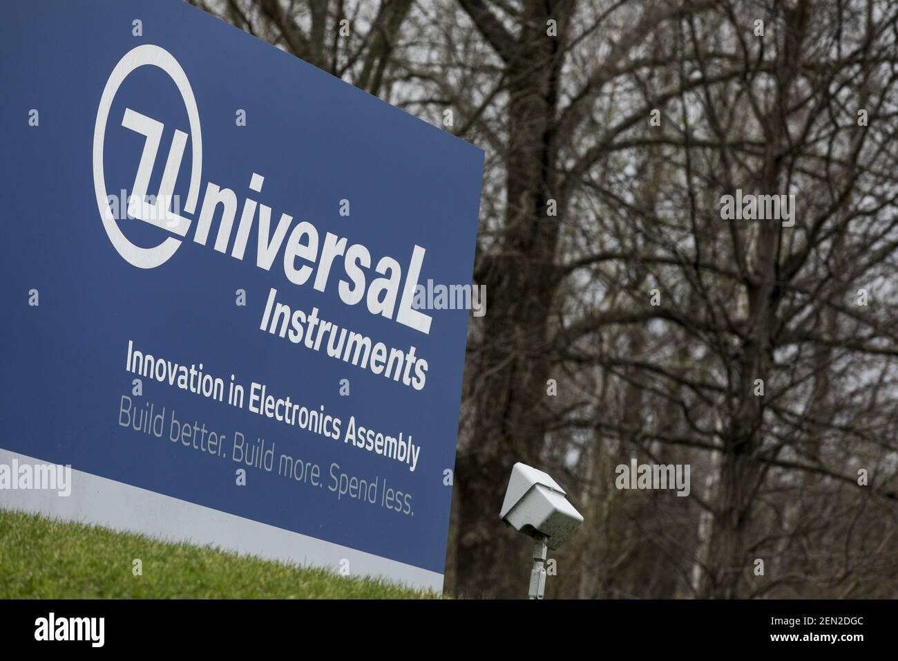 A logo sign outside of the headquarters of Universal Instruments in ...