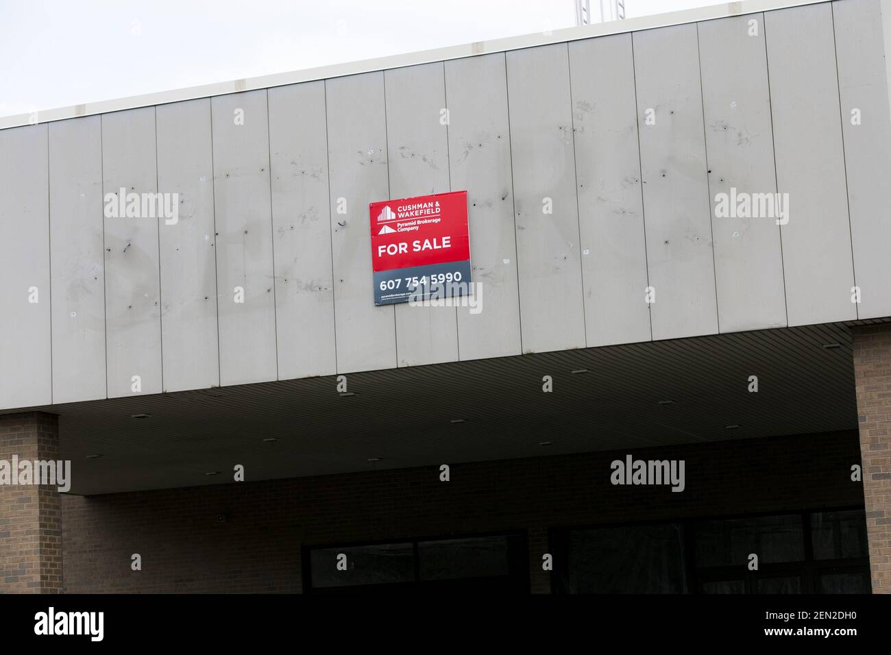 The outline of a Sears logo sign outside of a closed retail store ...