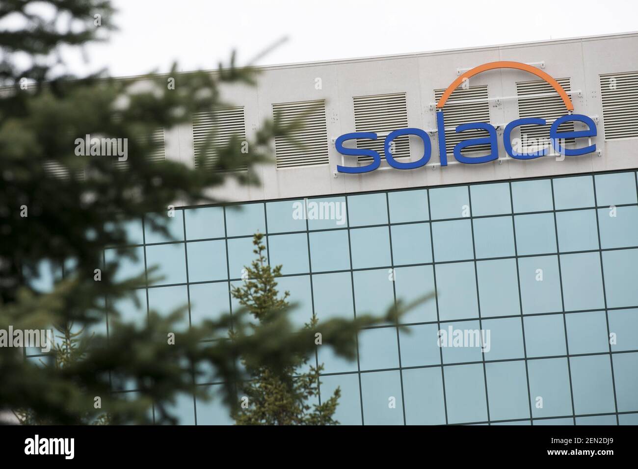 A logo sign outside of the headquarters of the Solace Corporation in ...