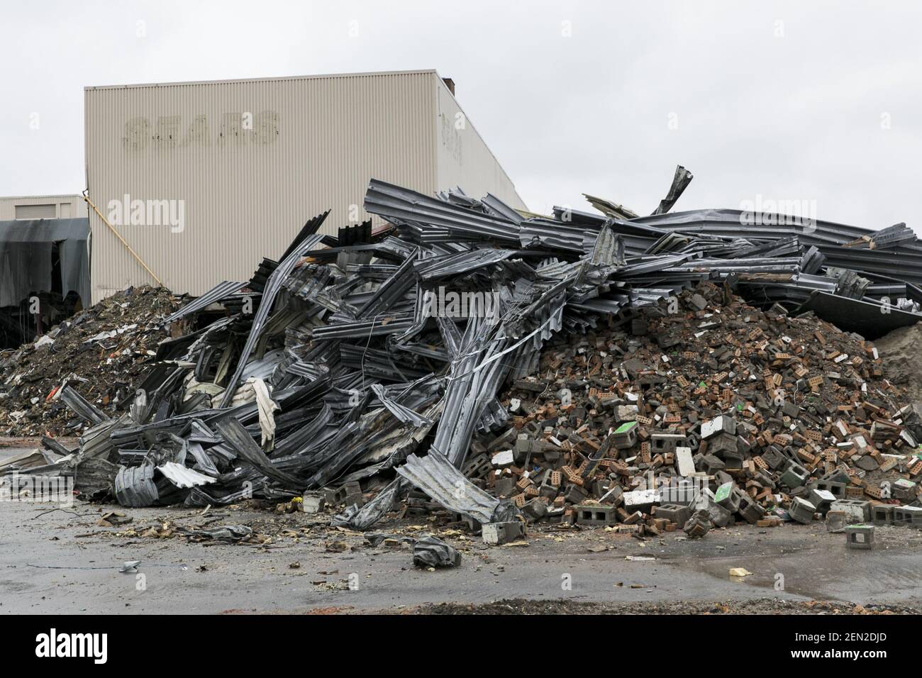 Debris surrounds the site of a closed Sears retail store during its ...