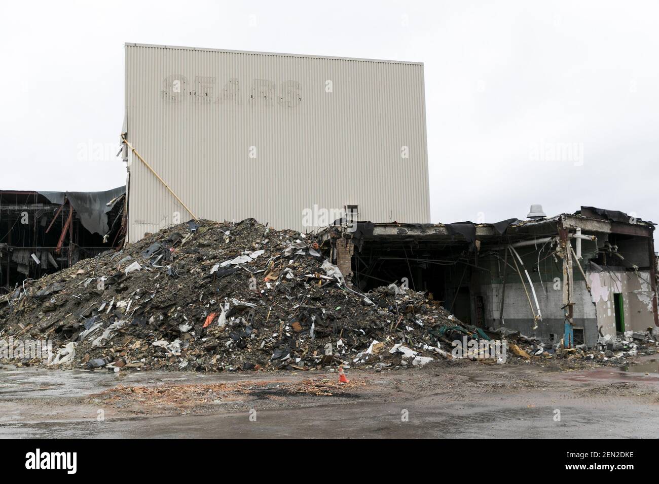 Debris surrounds the site of a closed Sears retail store during its ...