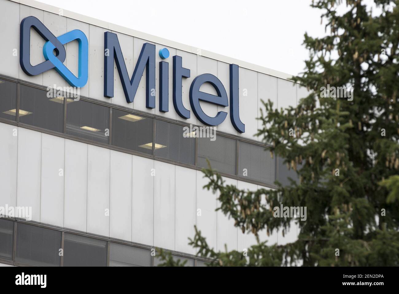 A logo sign outside of the headquarters of the Mitel Networks ...