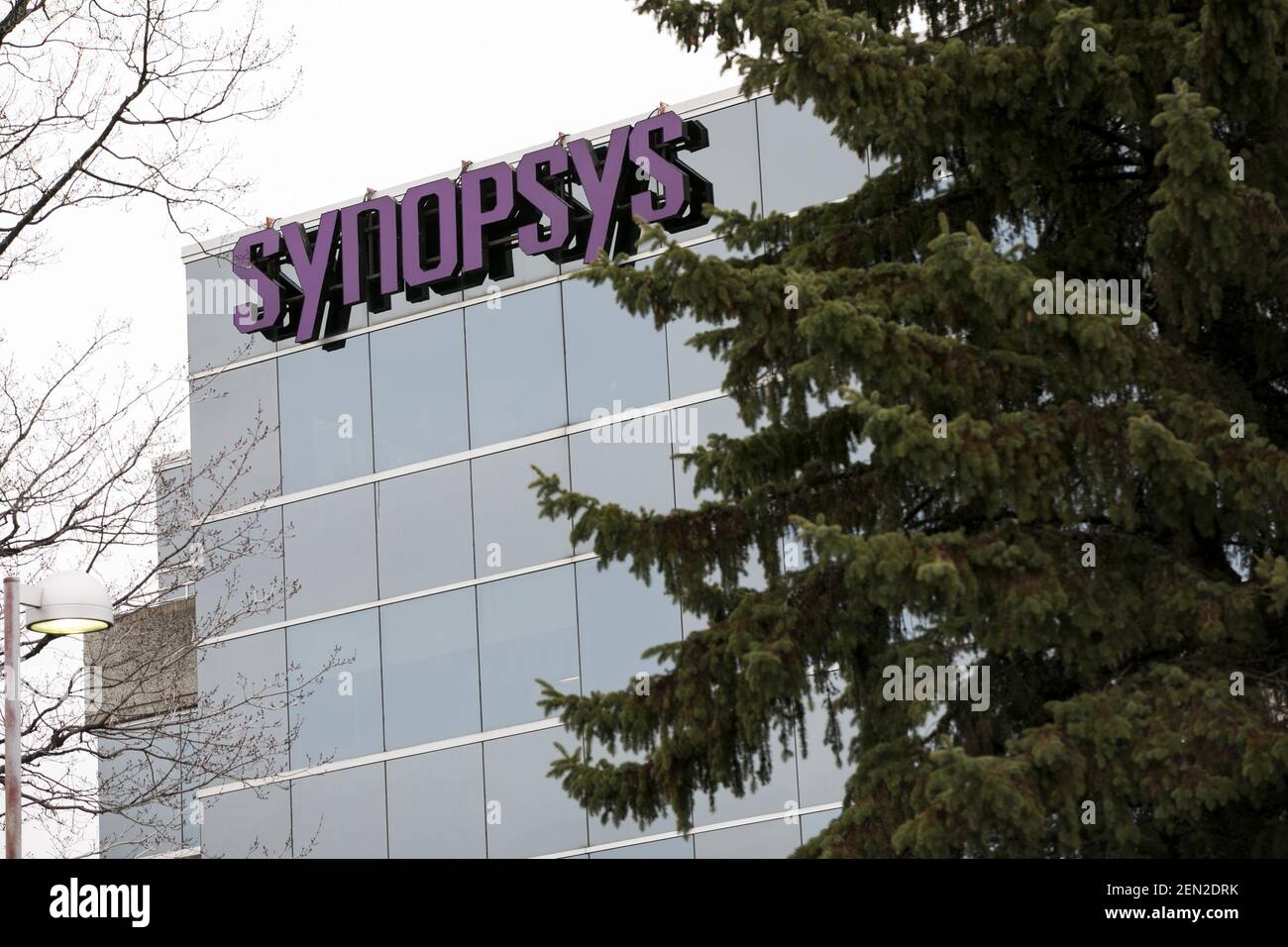 A logo sign outside of a facility occupied by Synopsys in Ottawa ...