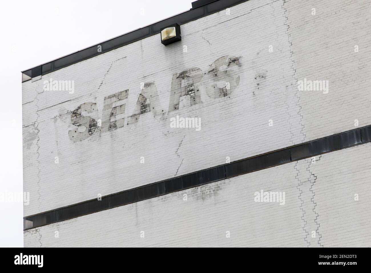 The outline of a logo sign is seen outside of a closed Sears retail ...