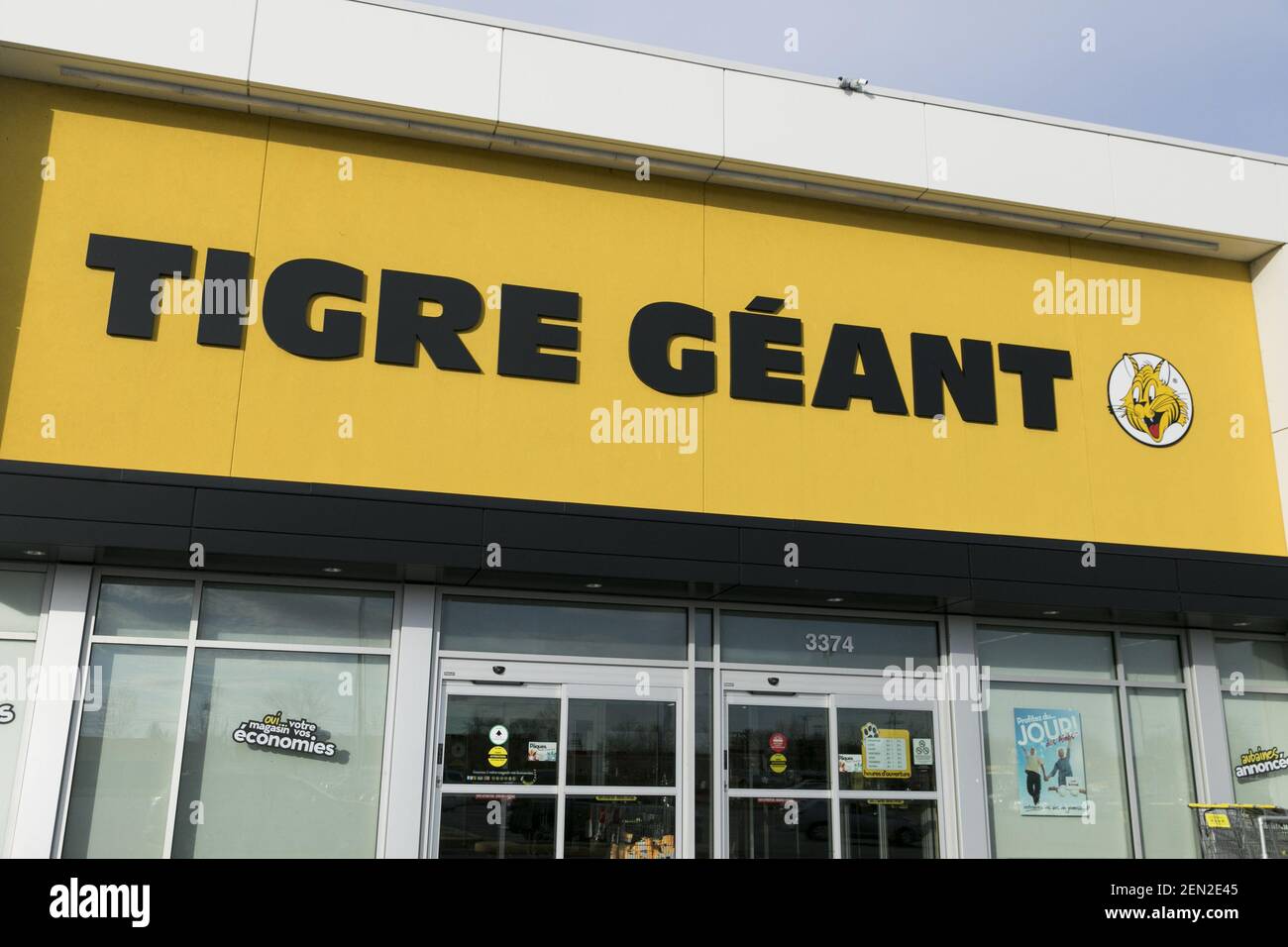 A logo sign outside of a Tigre Geant (Giant Tiger) retail store ...