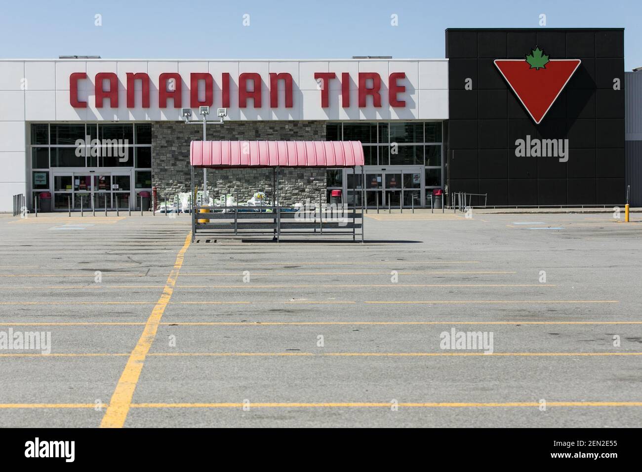 A logo sign outside of a Canadian Tire retail store location in ...