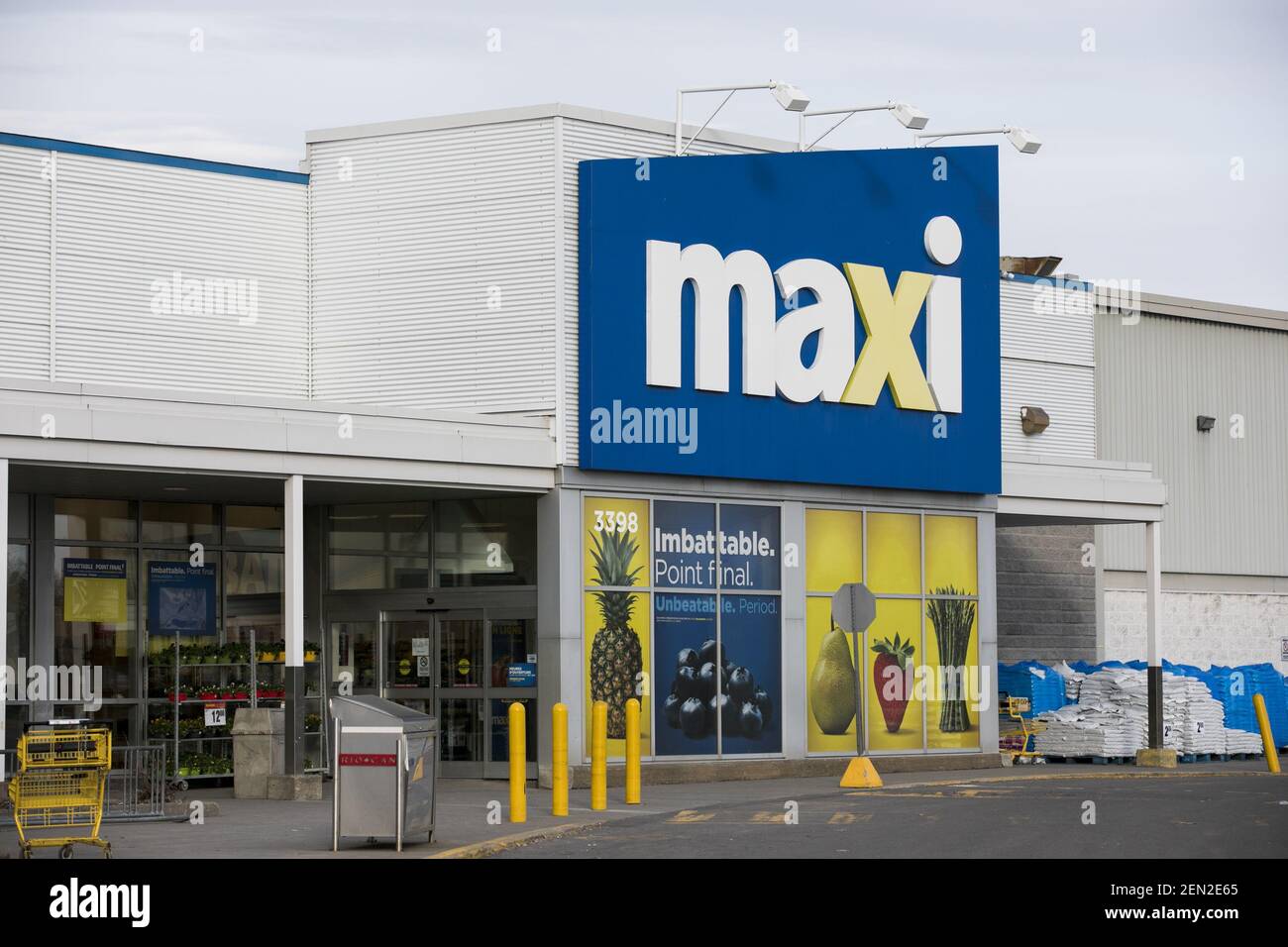 A logo sign outside of a Maxi retail grocery store location in ...