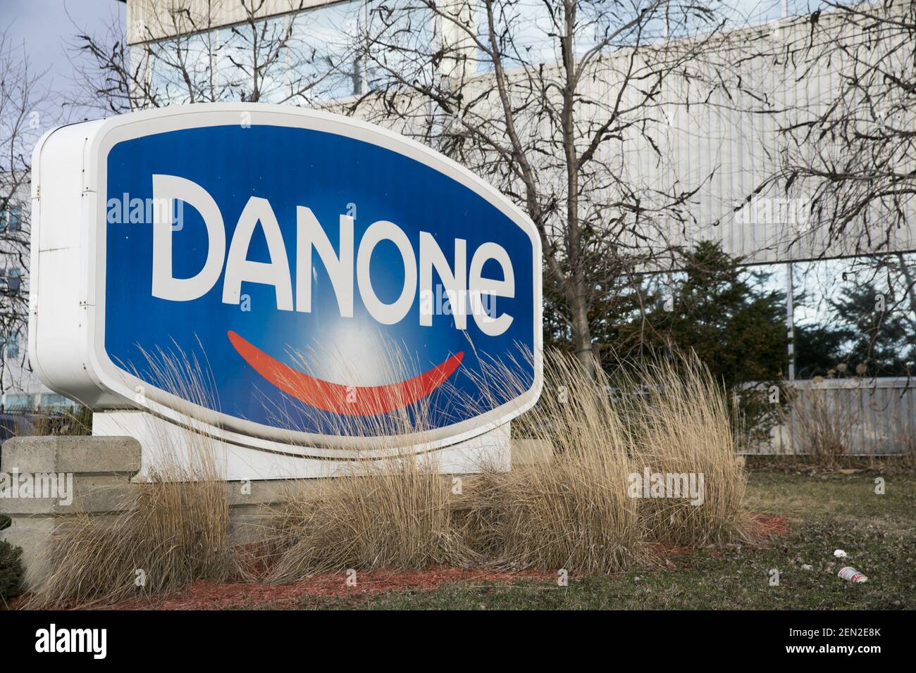 A logo sign outside of a facility occupied by Danone in Boucherville ...