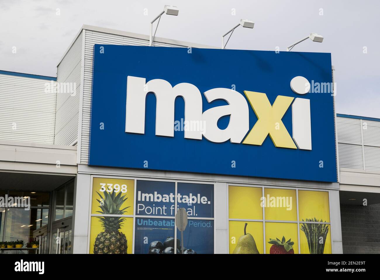 A logo sign outside of a Maxi retail grocery store location in ...