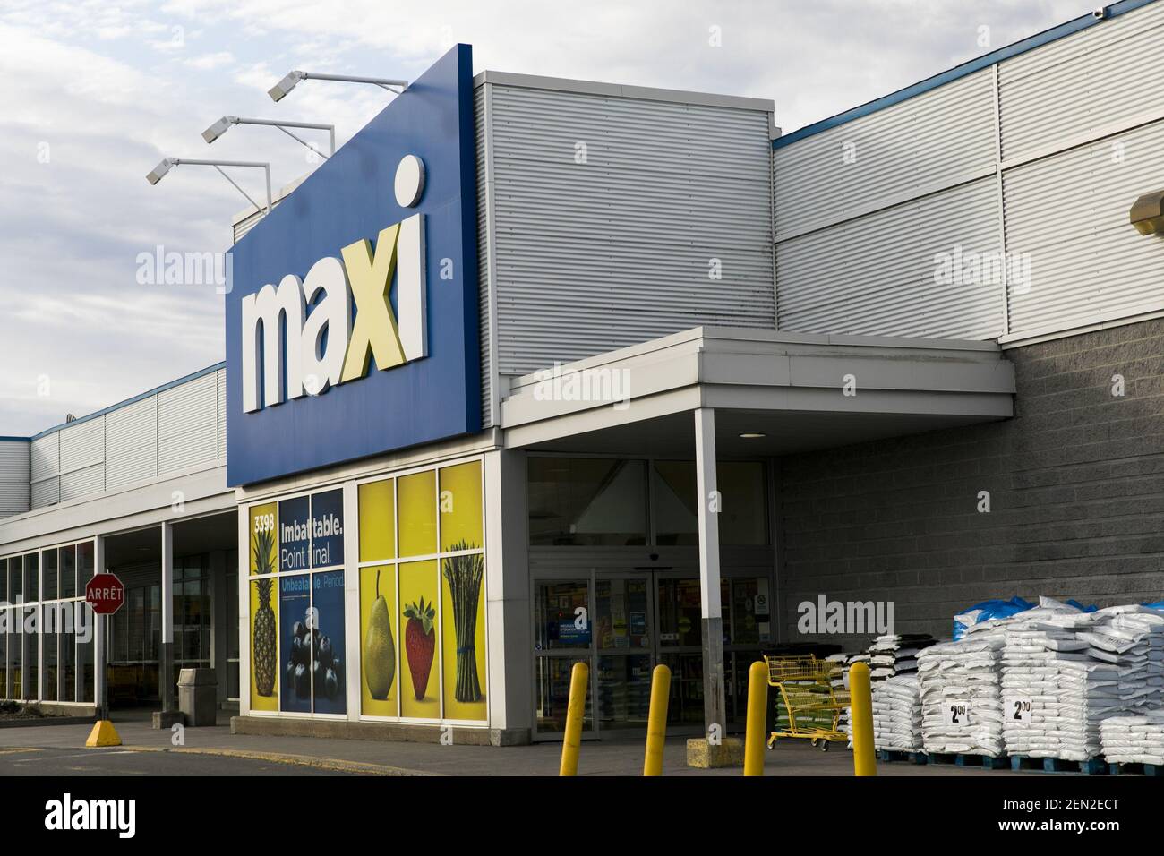 A logo sign outside of a Maxi retail grocery store location in ...