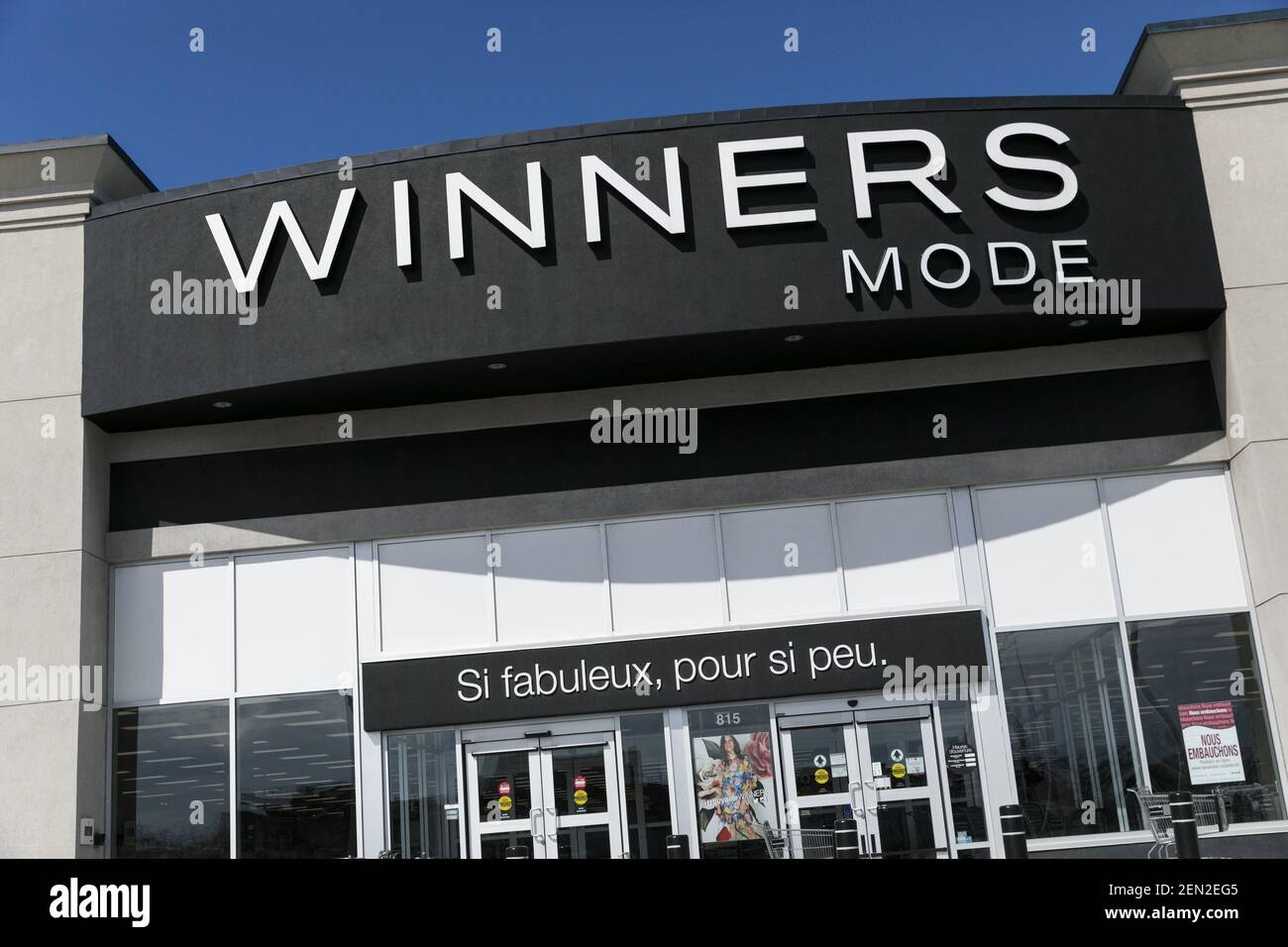 A logo sign outside of a Winners retail store location in Montreal ...