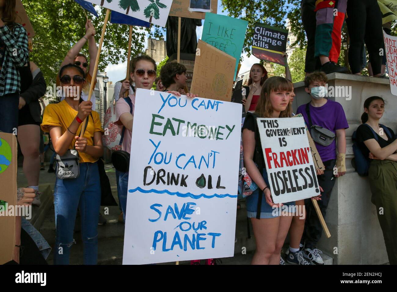 Students seen holding placards during the protest. Youth Strike for ...