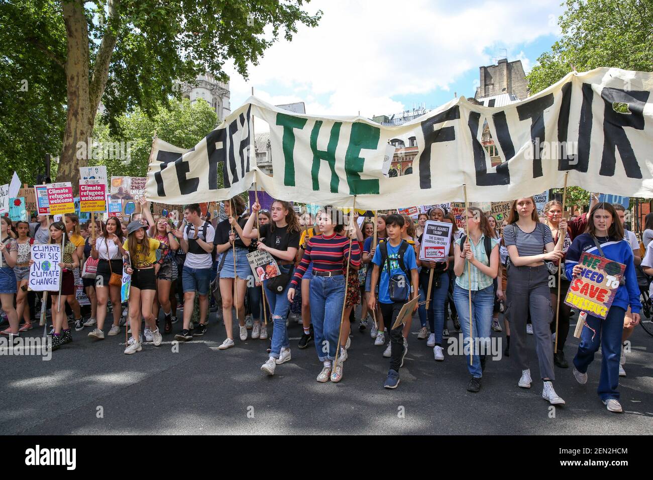 Students seen holding a banner and placards during the protest. Youth ...