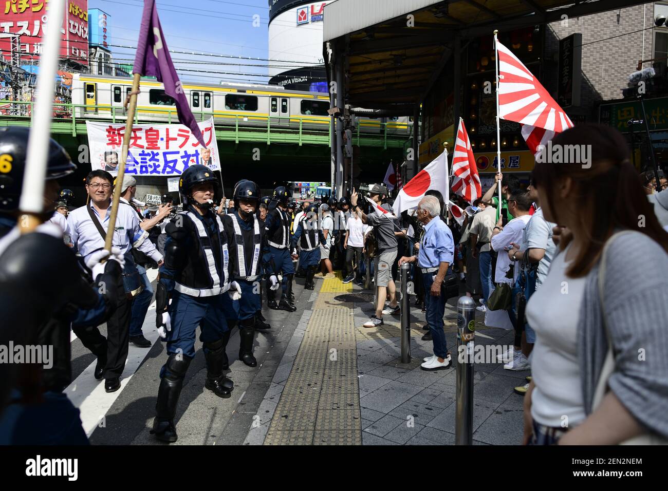 TOKYO, JAPAN - MAY 26: Protester holds a placard during a demonstration ...