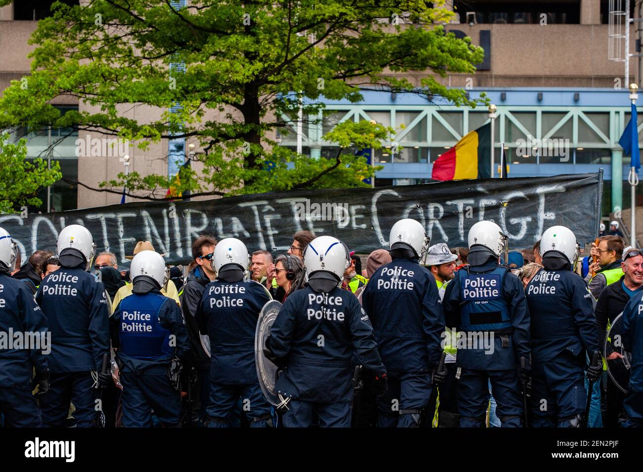 A group of riot police are seen stopping the yellow vest from walk ...
