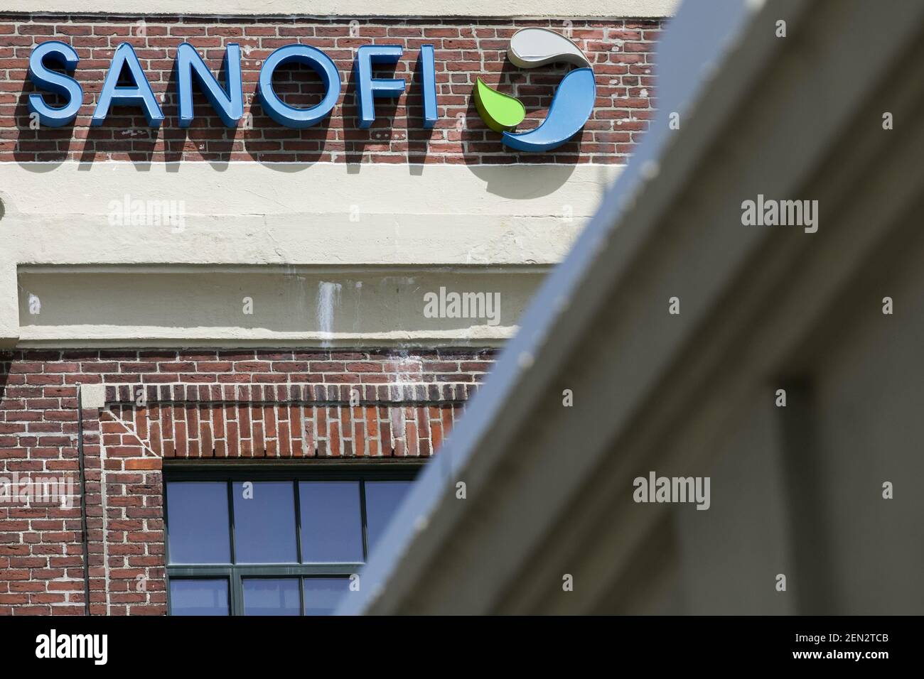 A logo sign outside of a facility occupied by Sanofi in Cambridge ...