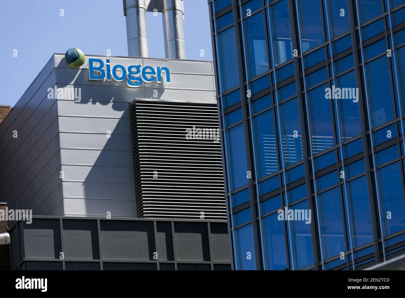 A logo sign outside of a facility occupied by Biogen Inc., in Cambridge ...