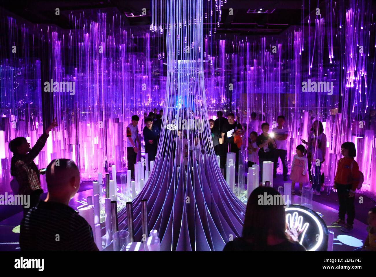 Visitors view an immersive digital art exhibition themed around big ...