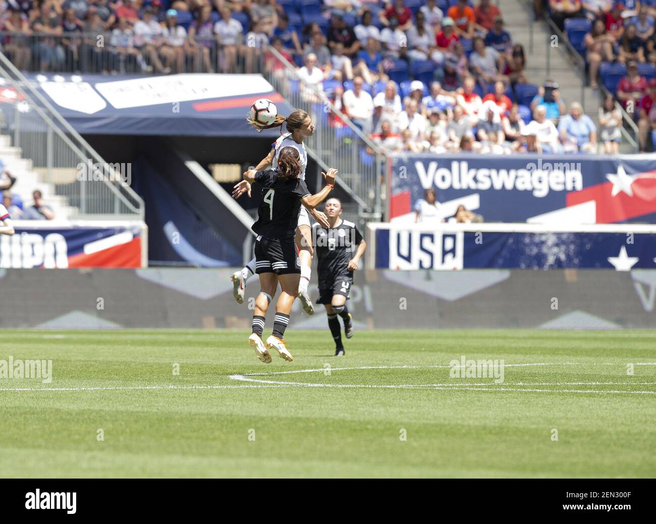 Tobin Heath (17) of USA wons air ball during friendly game against ...